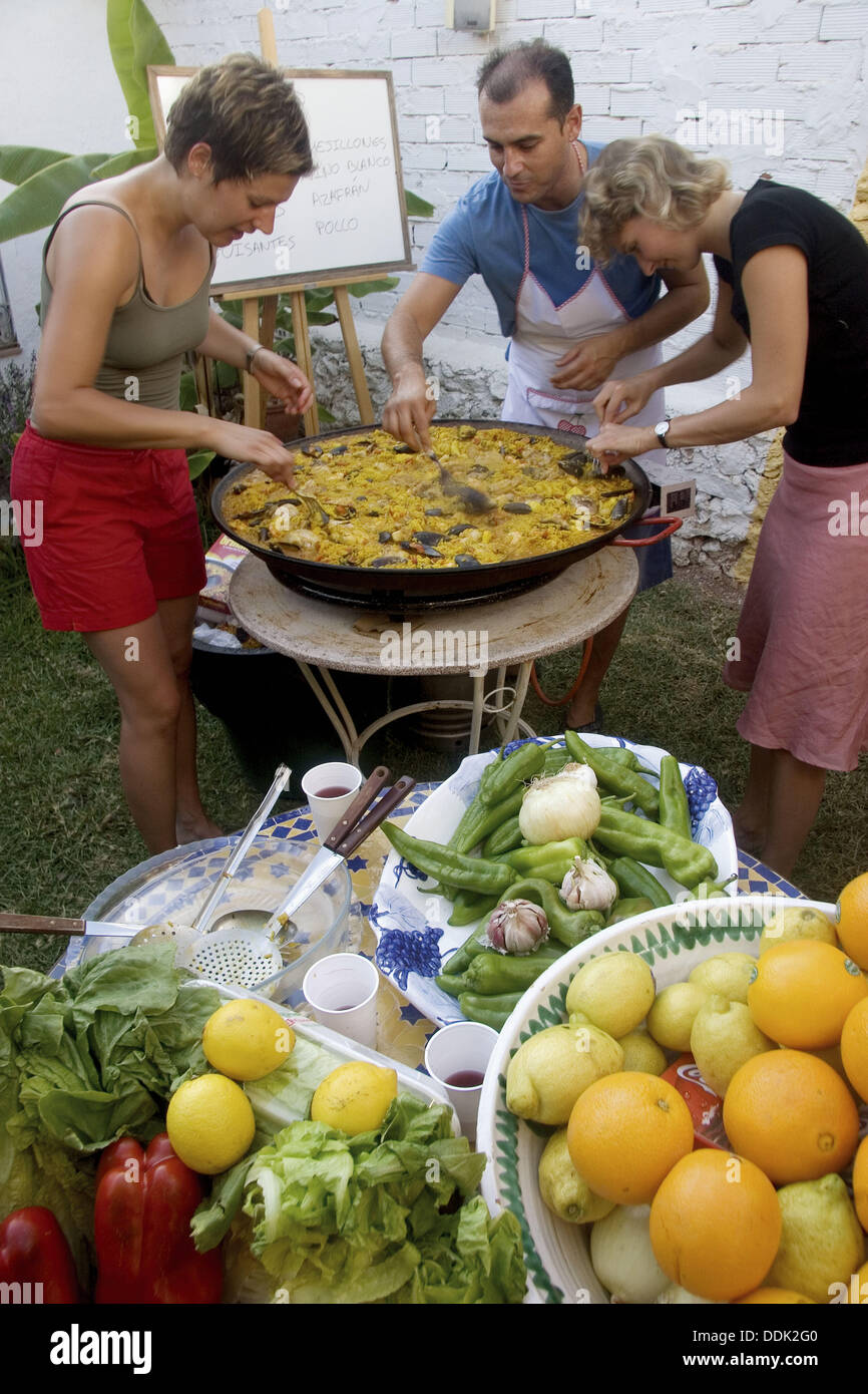 Learning how to cook paella hi-res stock photography and images - Alamy