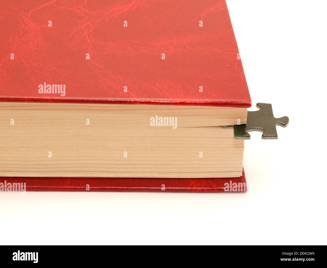 Puzzle and the book on a white background Stock Photo - Alamy