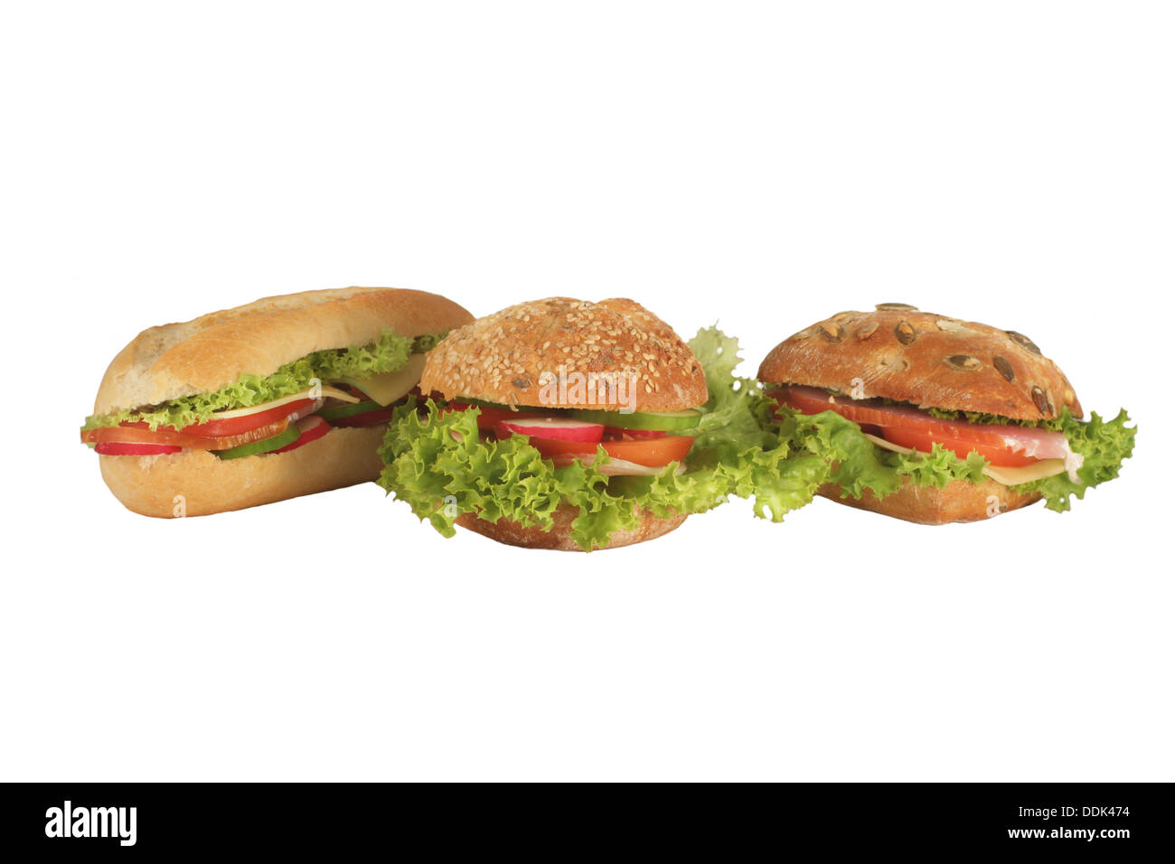 three sandwiches with vegetables and ham - sausage on white background ...
