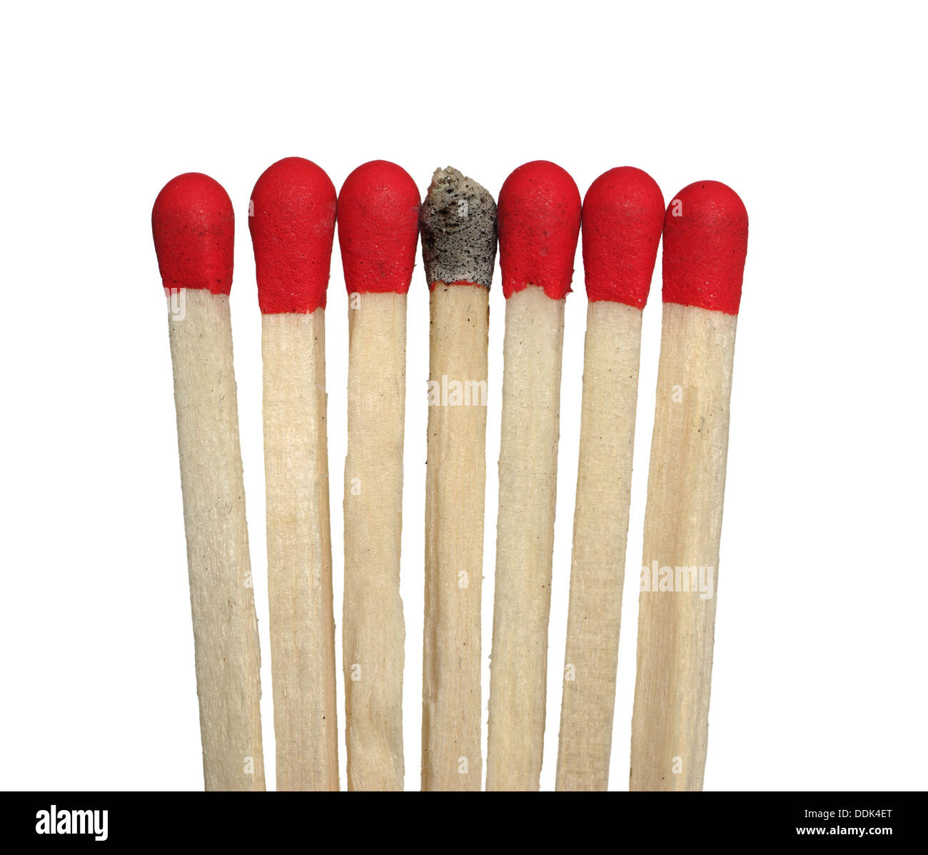six matches and one burnt on white background Stock Photo - Alamy