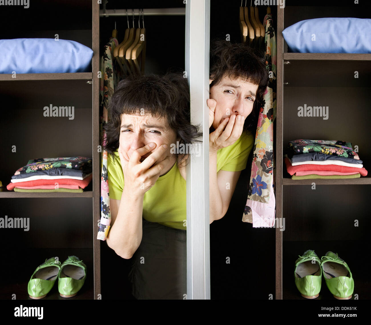 Woman hiding wardrobe hi-res stock photography and images - Alamy