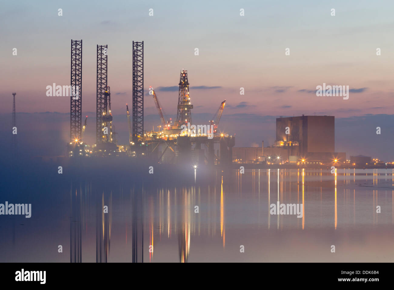 Drilling platforms and Hartlepool Nuclear Power Station at sunrise ...