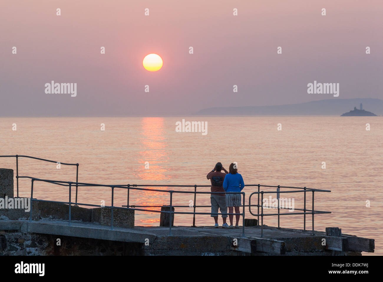 England, Cornwall, St.Ives, Silhouette of Couple at Sunrise Stock Photo ...