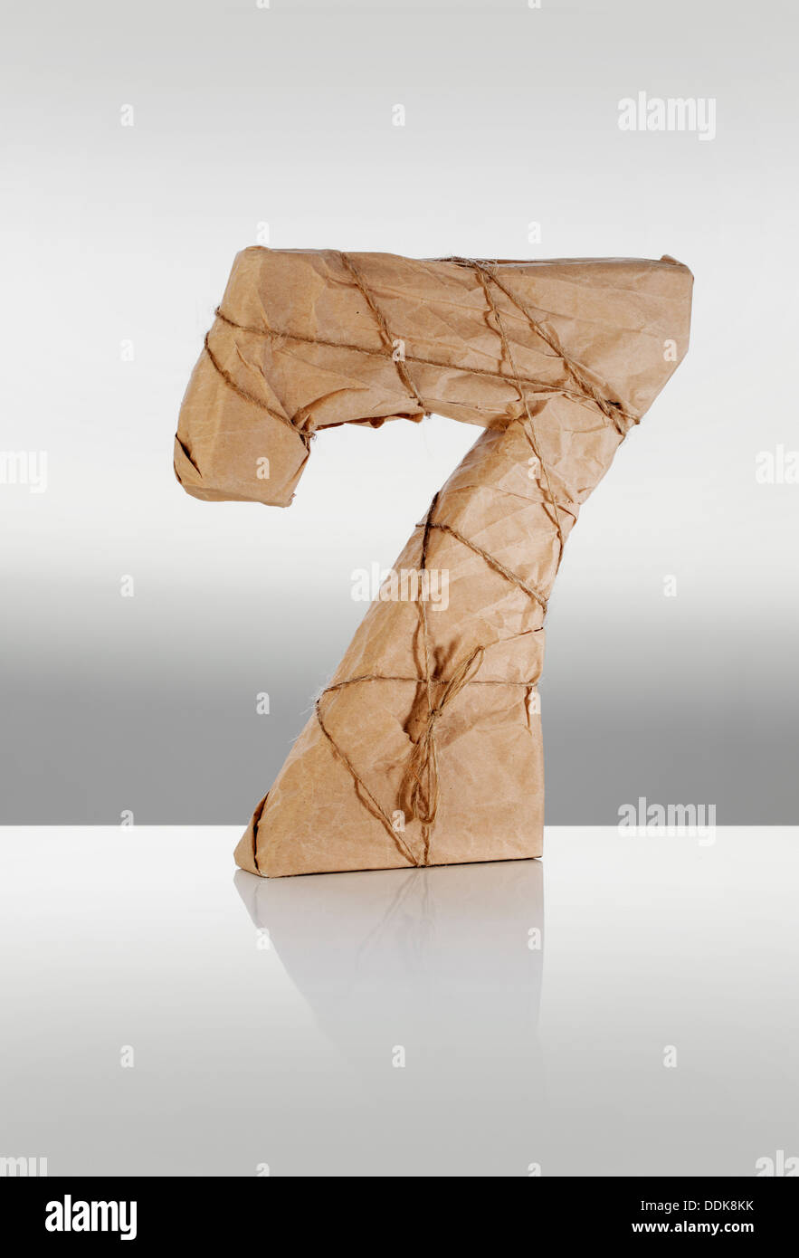 Number seven wrapped in brown paper Stock Photo - Alamy
