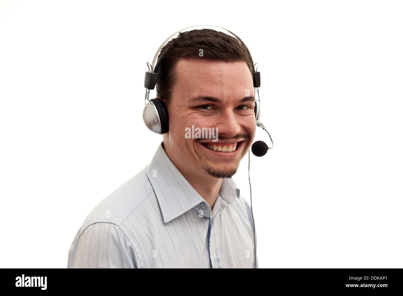 Man with a headset on, as in a call center Stock Photo - Alamy