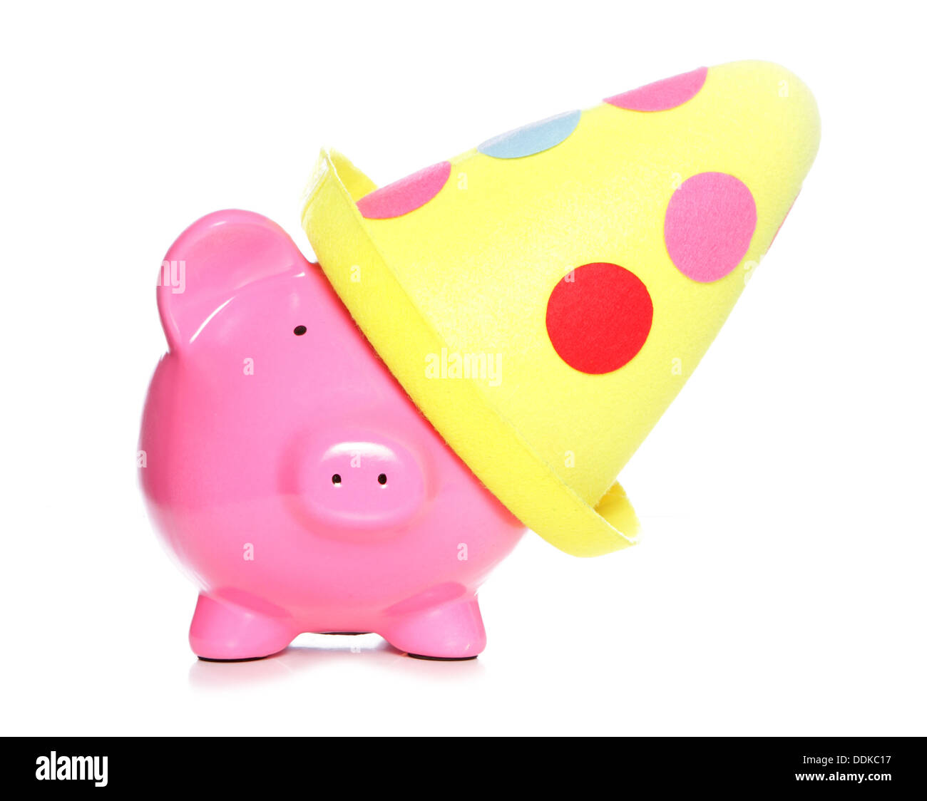 piggy bank wearing party hat on white background Stock Photo - Alamy