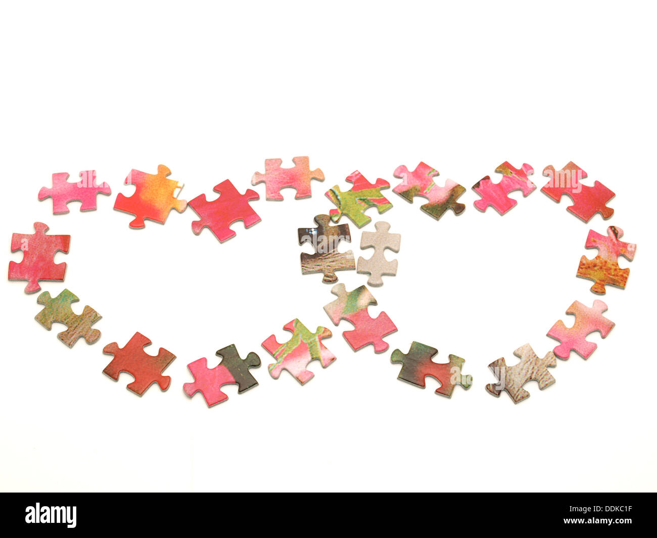 Two heart from a puzzle on a white background Stock Photo - Alamy