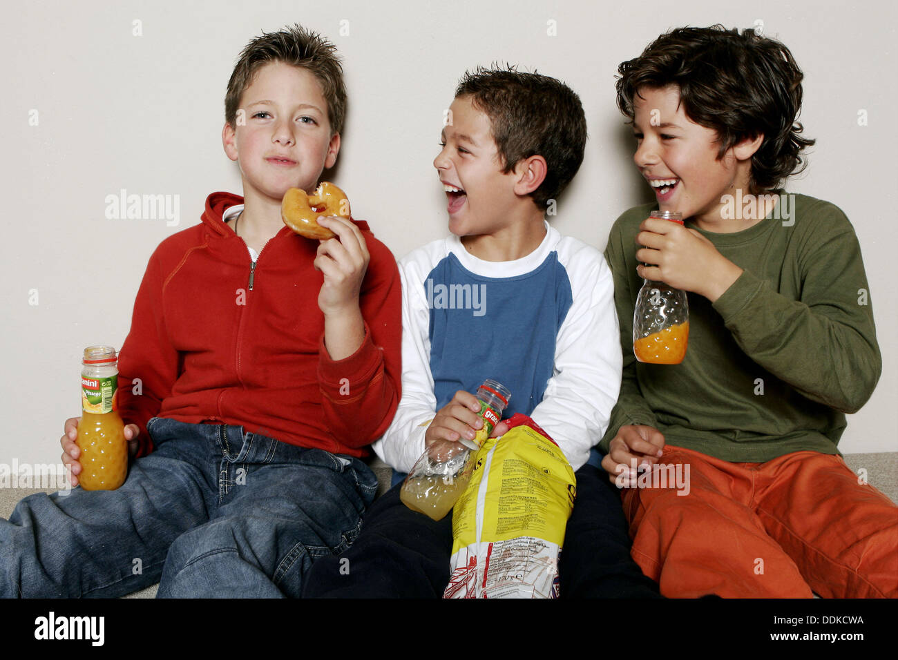 Kid eating fruit doughnut hi-res stock photography and images - Alamy