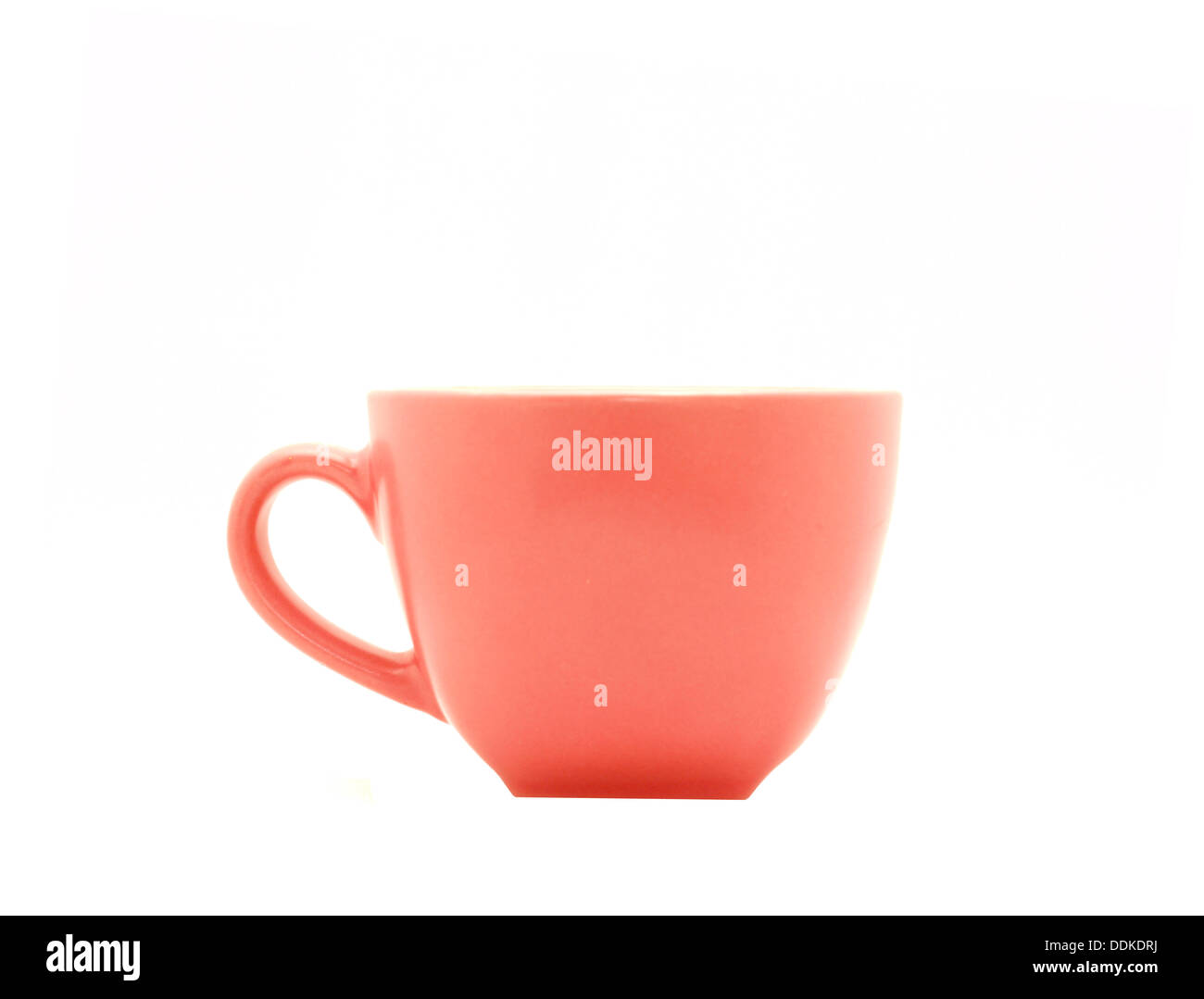Pink ceramic cup on a white background Stock Photo - Alamy