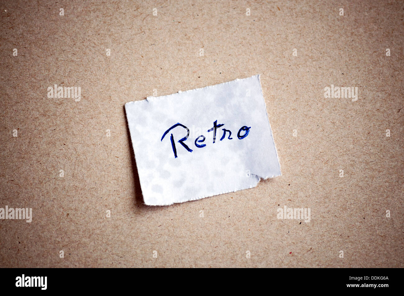 Retro message,written on piece of paper, on cardboard background. Space ...