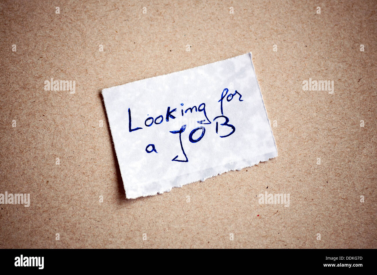 Looking for a Job message,written on piece of paper, on cardboard ...