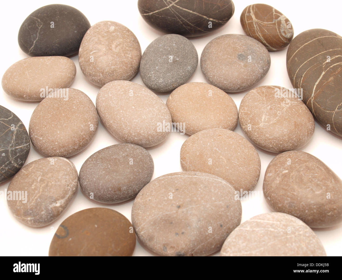 Background from a pebble on a white background Stock Photo - Alamy
