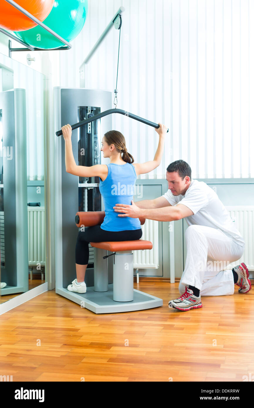 Patient at the physiotherapy making physical exercises with her ...