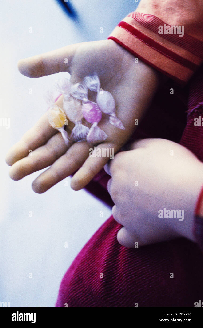 Candies hand hi-res stock photography and images - Alamy