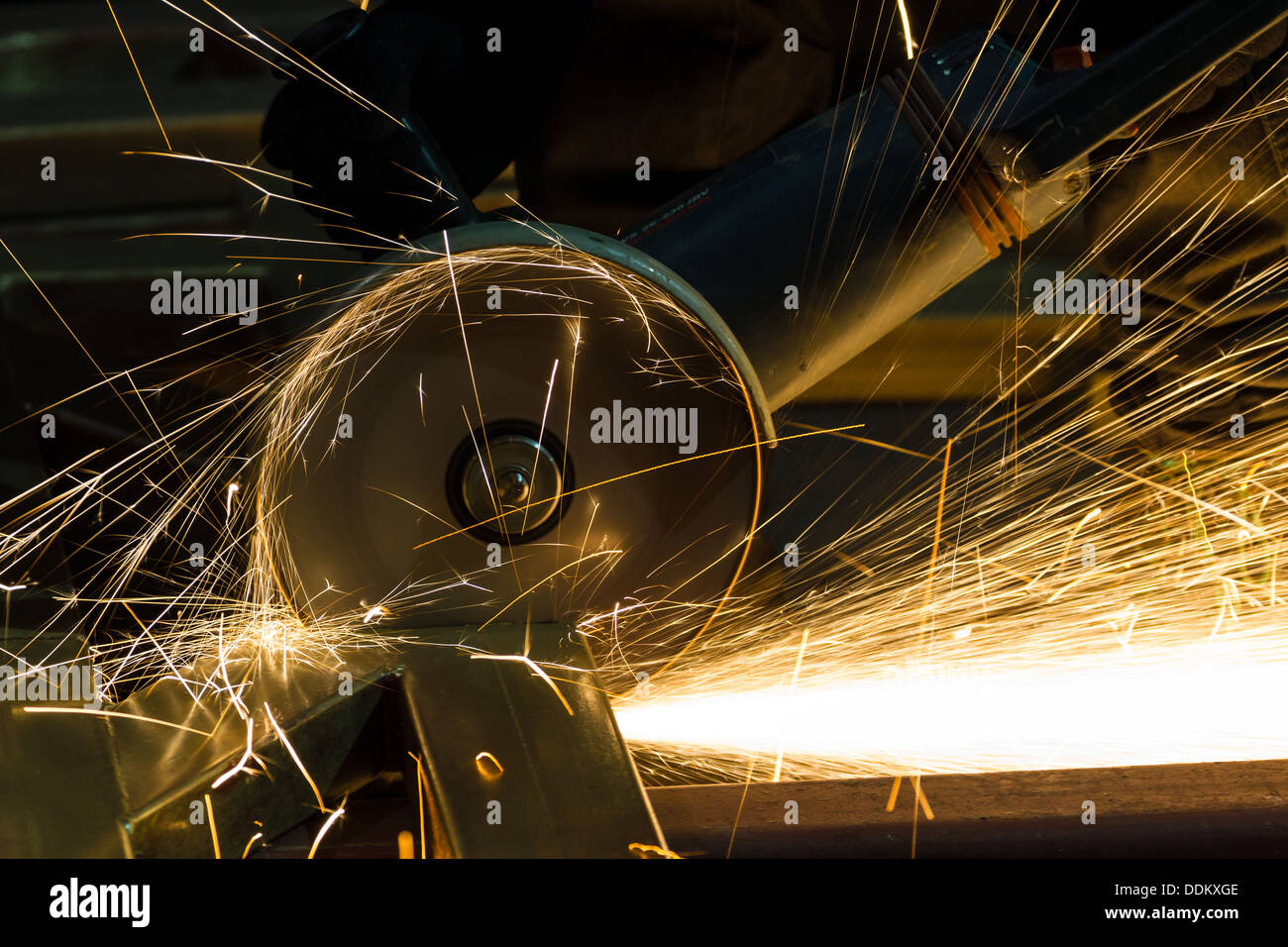 sharpening and cutting of iron by abrasive disk machine Stock Photo - Alamy