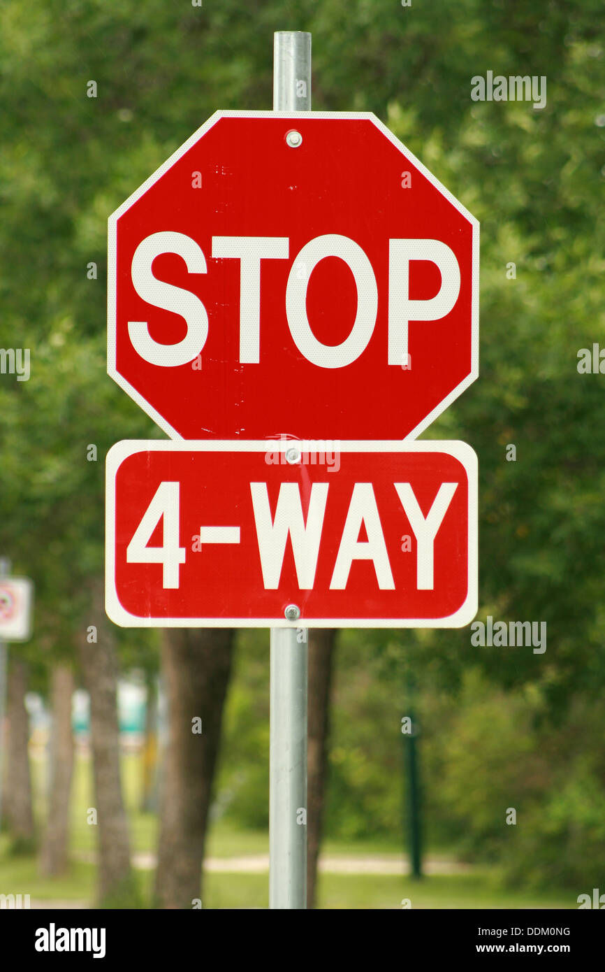 A 4-way stop sign on the side of a road in Altona, Manitoba, Canada ...