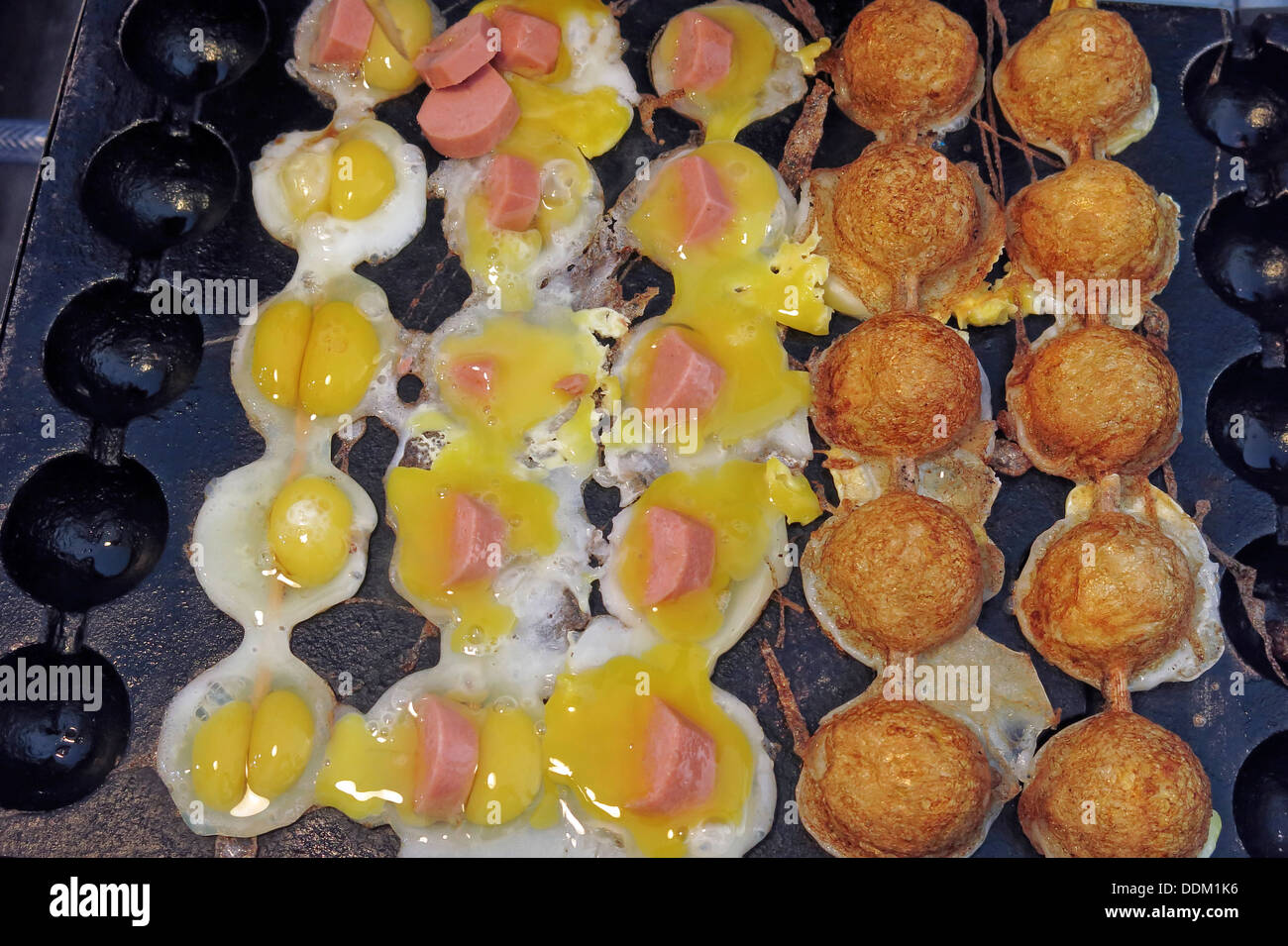 Fast food quail egg and sausage snacks at Jonker street market in ...