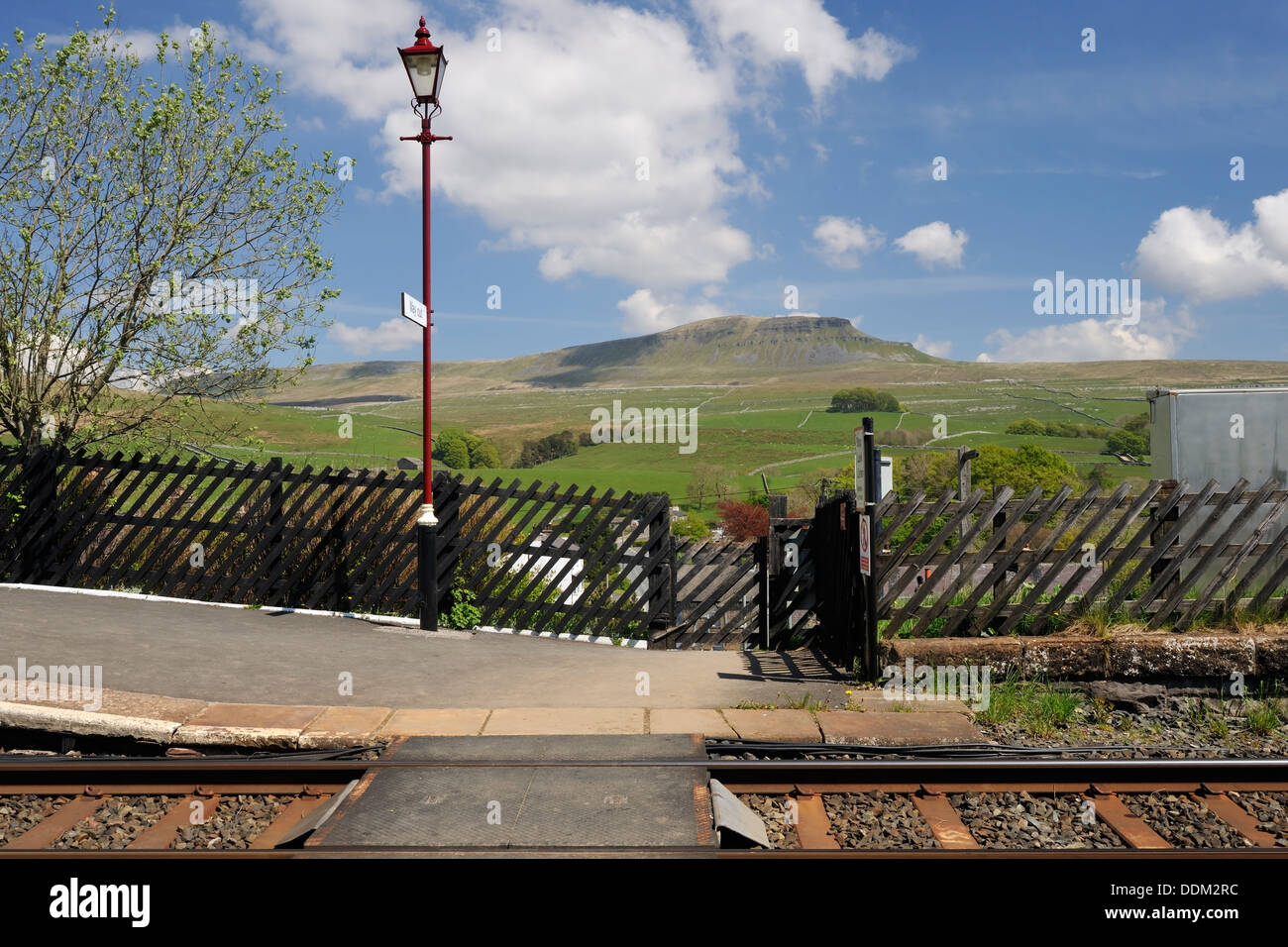 The Pennine-way footpath to Pen-y-ghent crossing the rail track at ...