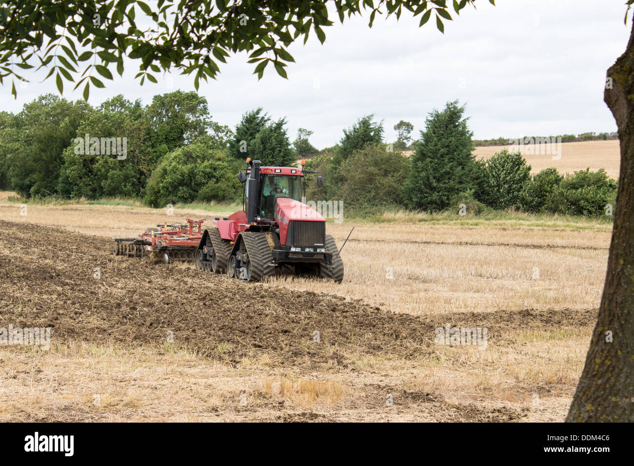 Tractor in field Stock Photo - Alamy