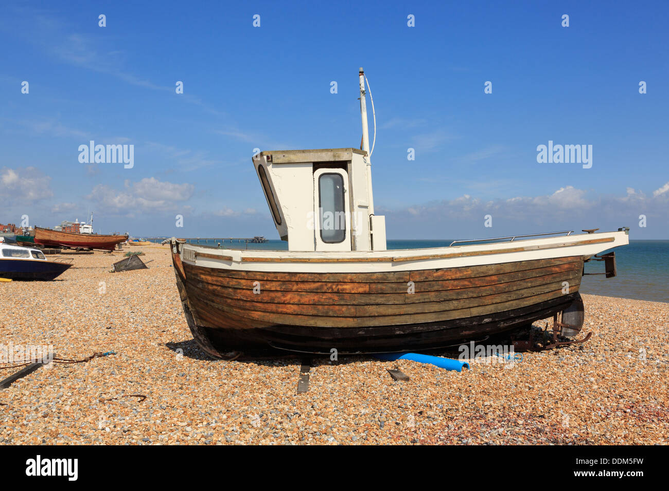 Traditional fishing boat on shingle Walmer beach on the south coast in ...