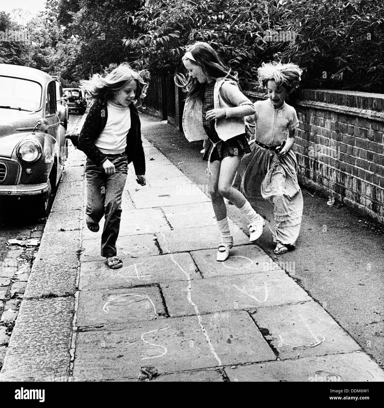 Children playing hopscotch on a London street, c1970. Artist: Henry ...