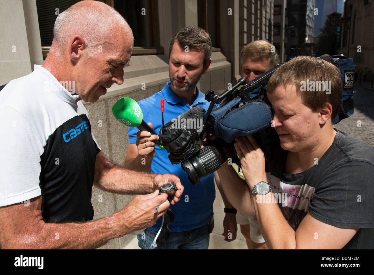 London, UK. Wednesday 4th September 2013. Man being interviewed by tv ...