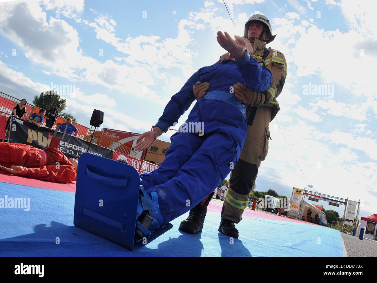 ILLUSTRATION - A fire fighter carries a puppet during a demonstration ...