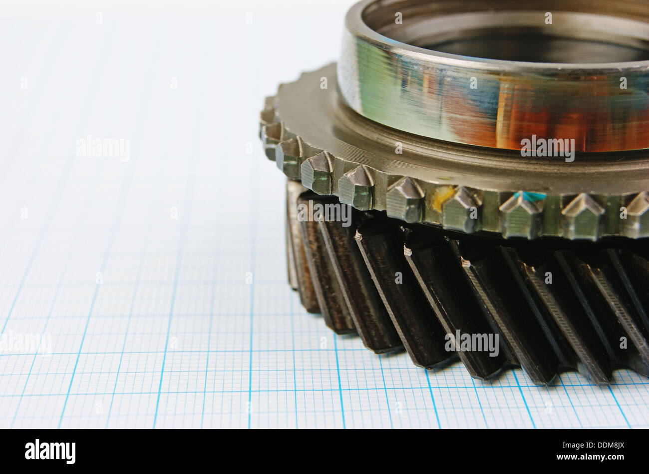 Gear on graph paper Stock Photo - Alamy
