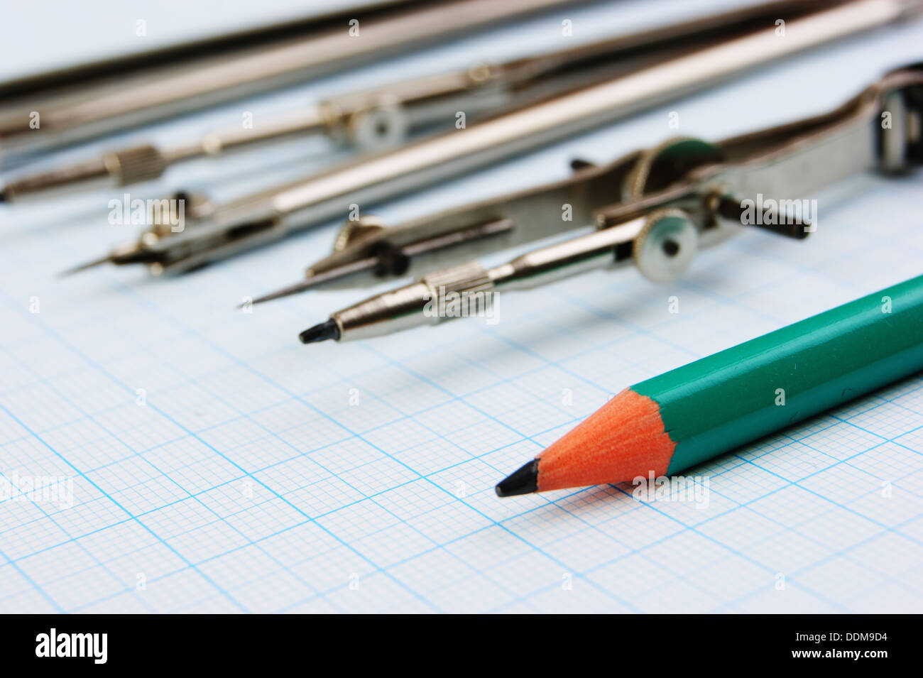 Old drawing tools on graph paper Stock Photo - Alamy