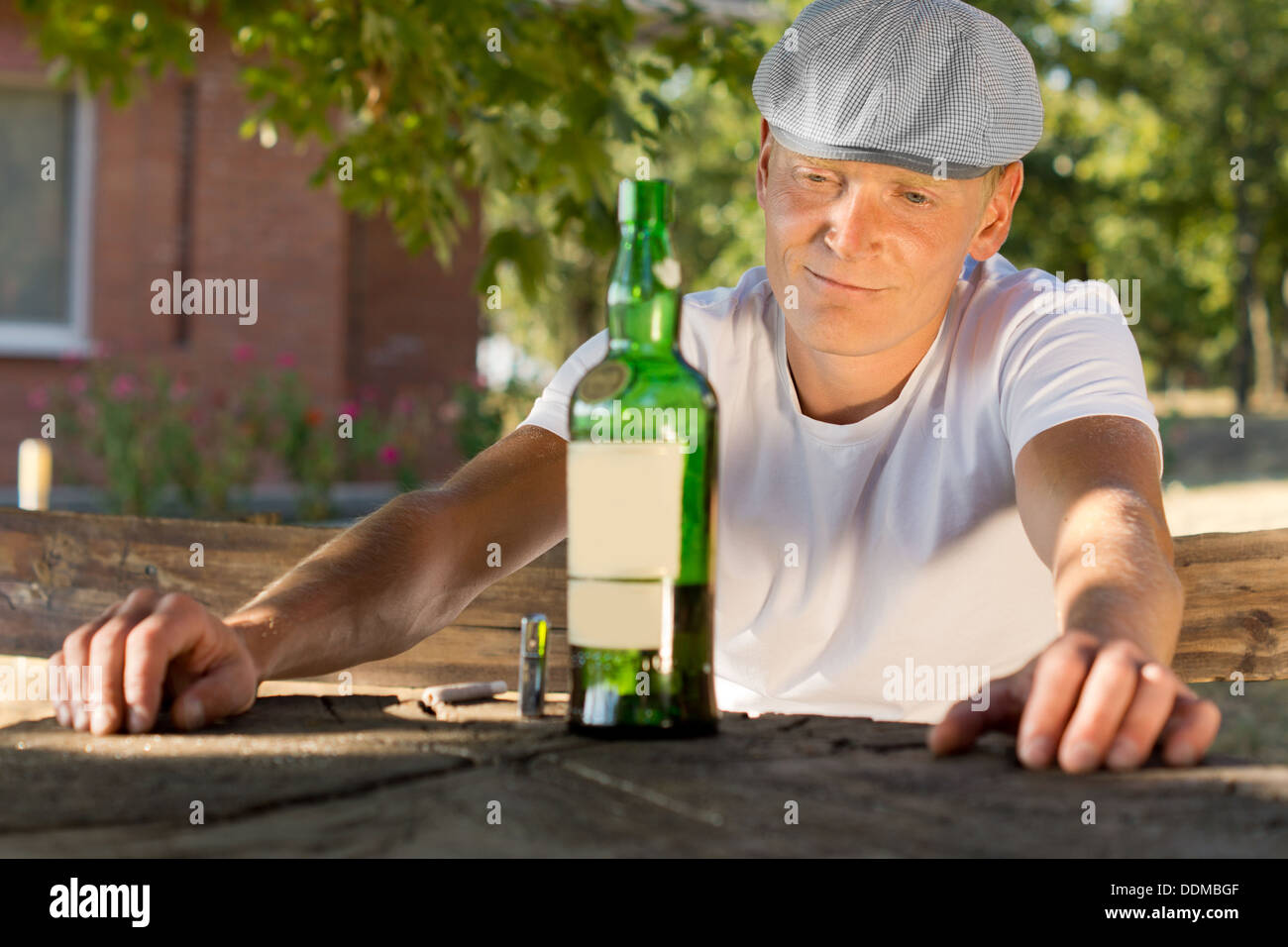 Drunk man sitting table alcohol hi-res stock photography and images - Alamy