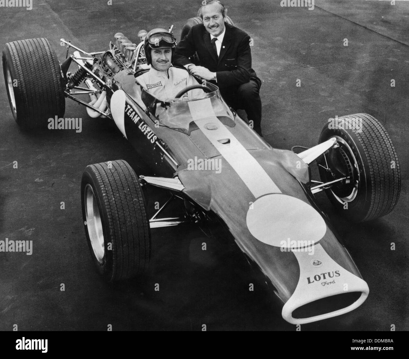 Graham Hill and Colin Chapman with Lotus 49, 1967. Artist: Unknown ...