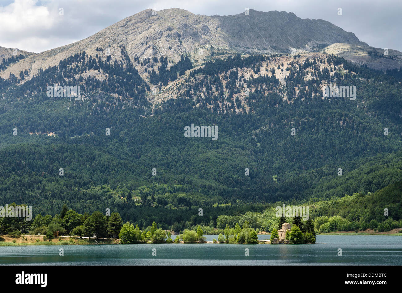 The chapel of Agios Fanourios on Lake Doxis with the mass of Mount ...