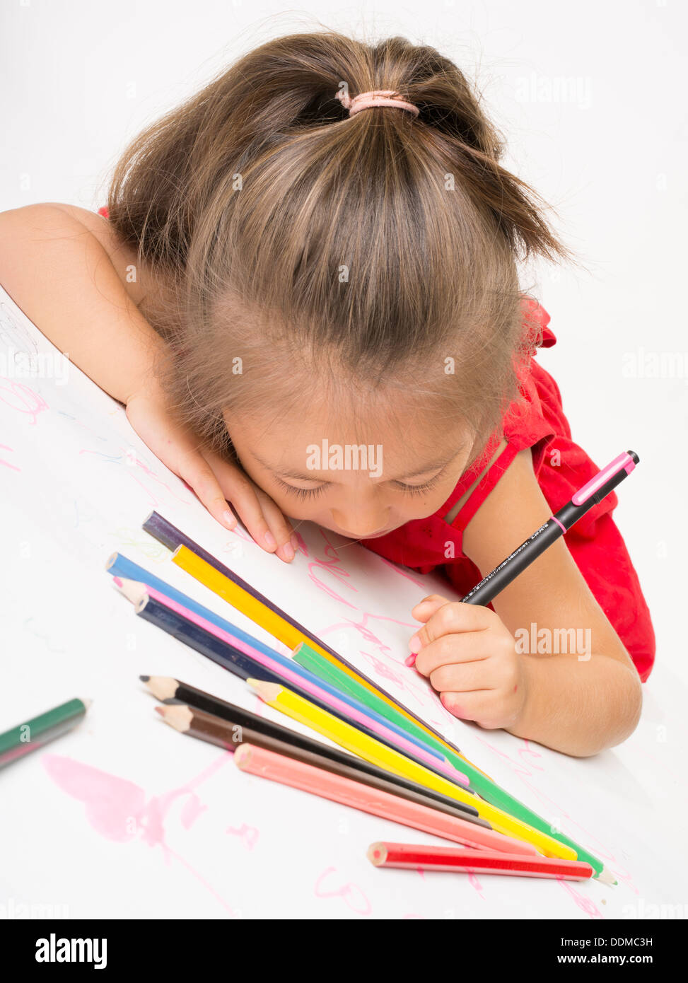 Young girl coloring with colored pencils Stock Photo - Alamy
