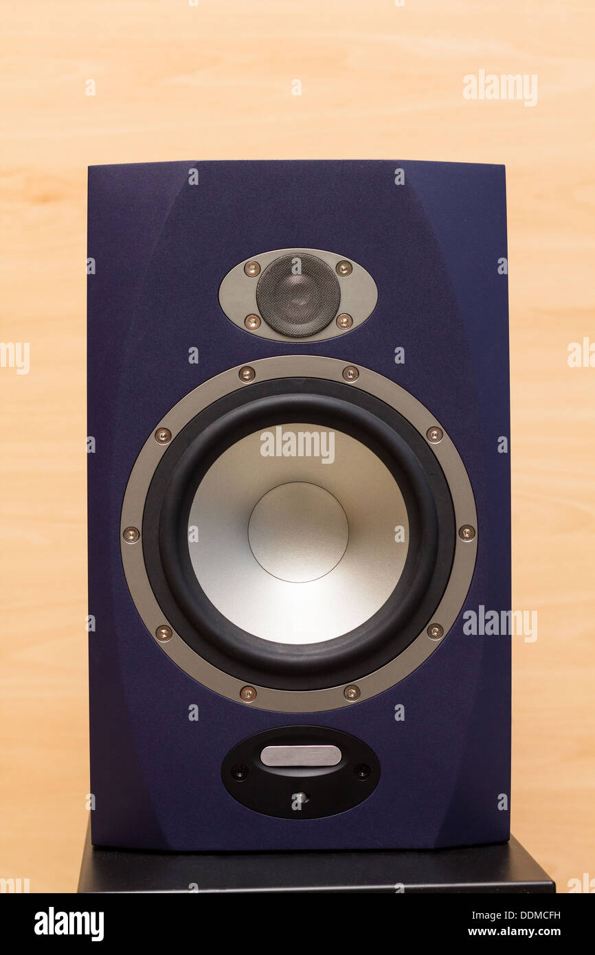 Blue Speaker on a stand with wood background Stock Photo - Alamy