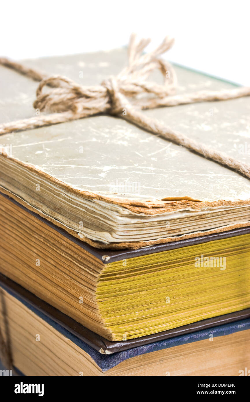 stack of old books tied with rope isolated on white Stock Photo - Alamy
