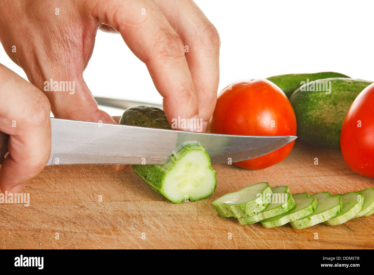 chop tomatoes and cucumbers isolated on white background Stock Photo ...