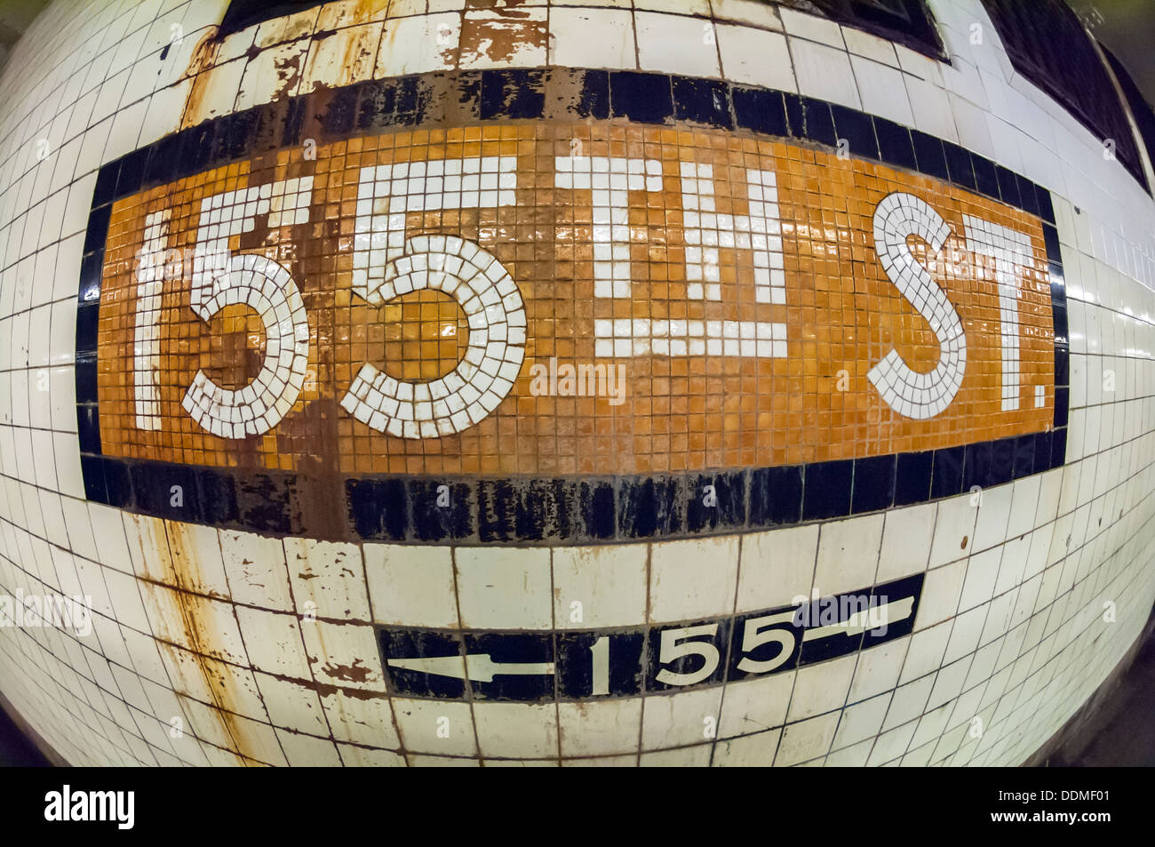 Damaged and dirty decorative tiles on the wall of the West 155th Street ...