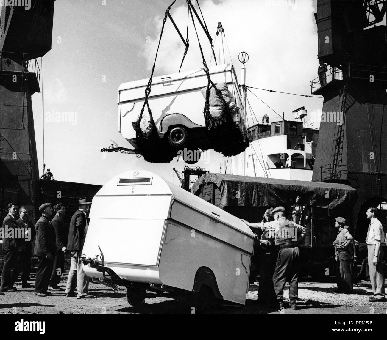 Unloading trailers from a ship, (c1950s?). Artist: Unknown Stock Photo ...