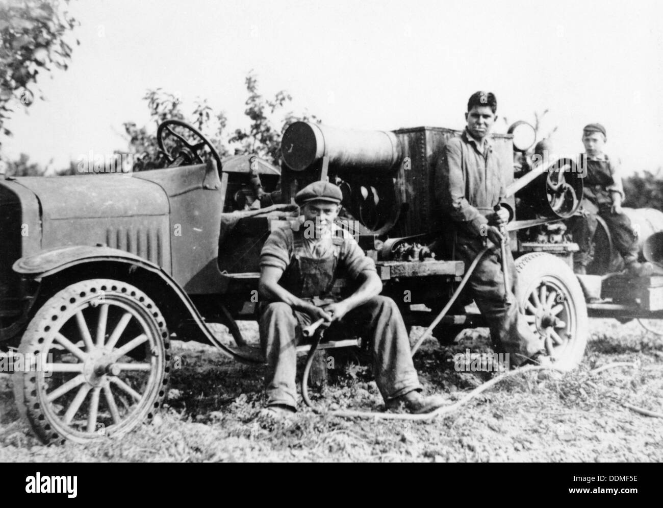 Farmworkers with a tractor, (c1930s?). Artist: Unknown Stock Photo - Alamy