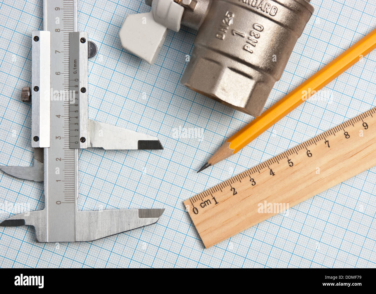 water inlet valve on a background of graph paper Stock Photo - Alamy