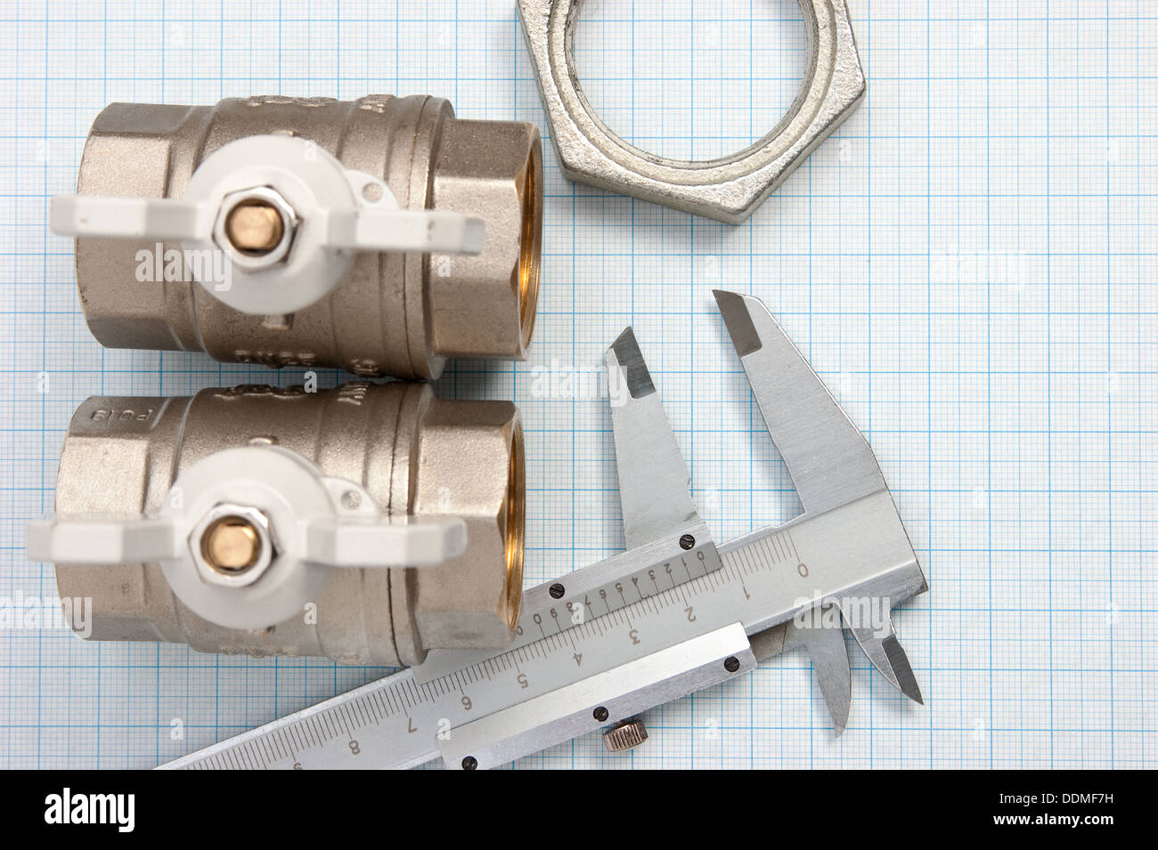 water inlet valve on a background of graph paper Stock Photo - Alamy