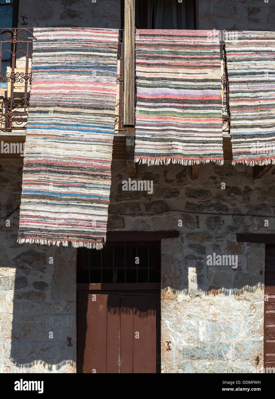 Rag Rugs Drying On A Balcony In The Little Village Of Zatouna Near Dimitsana Arcadia rag-rugs-drying-on-a-balcony-in-the-little-village-of-zatouna-near-dimitsana-arcadia
