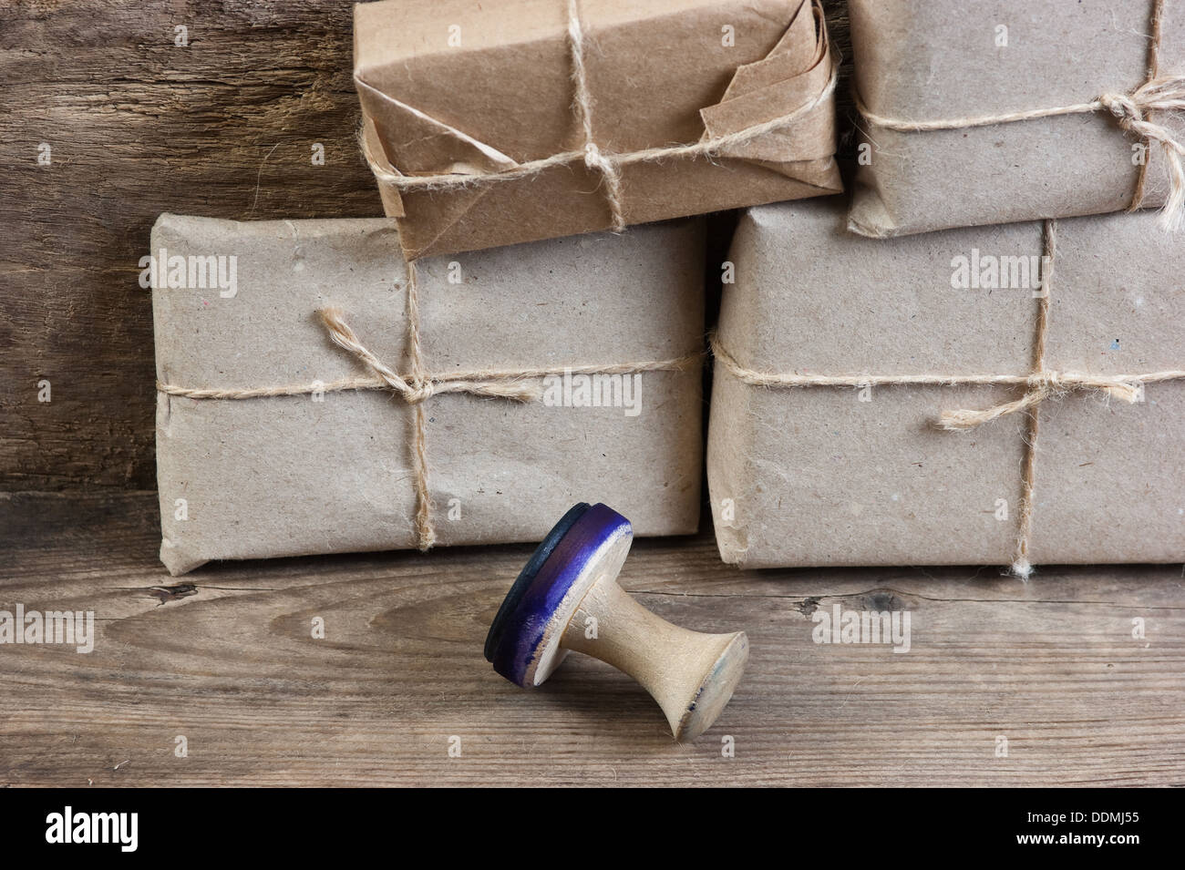 pile parcel wrapped with brown kraft paper and stamp Stock Photo - Alamy