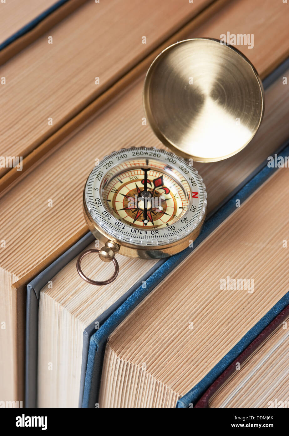 compass and the old books Stock Photo - Alamy