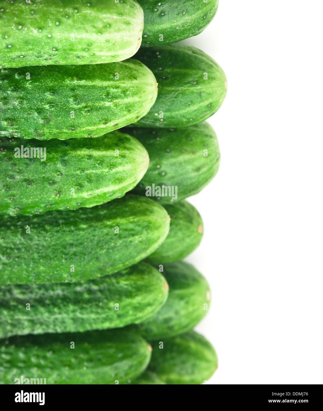 bunch of cucumbers isolated on white background Stock Photo - Alamy