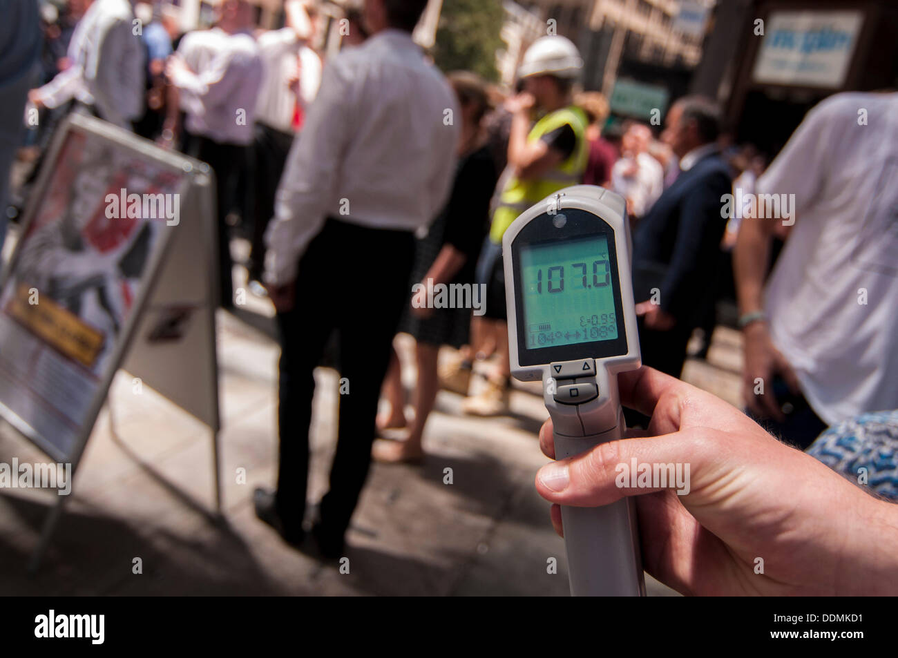 London, UK. 4th Sept, 2013. A handheld thermometer records the ...