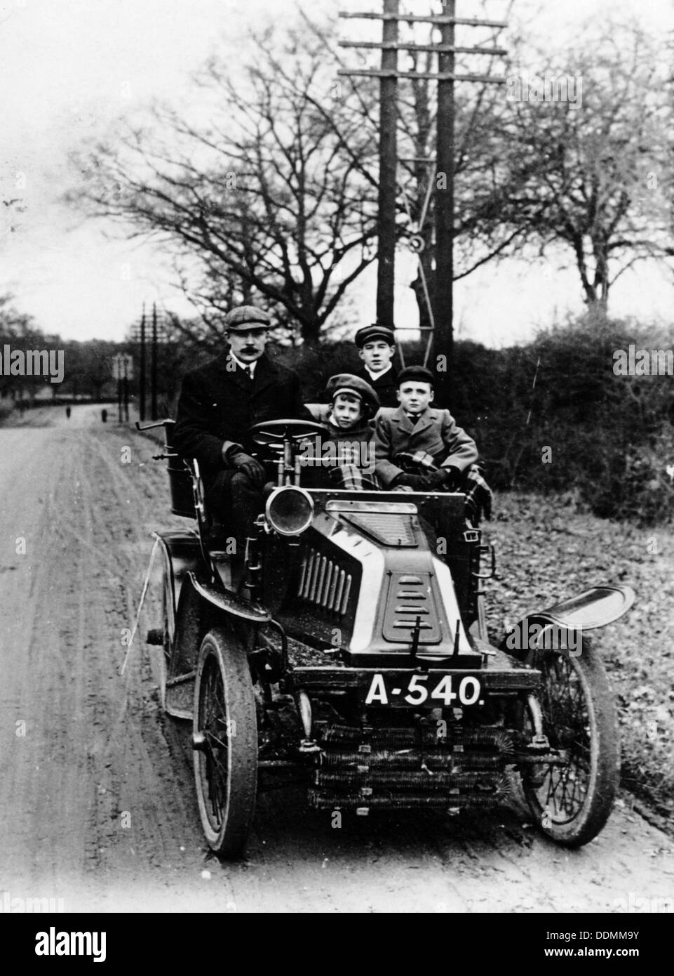 A man and boys in a De Dion car, 1908. Artist: Unknown Stock Photo - Alamy