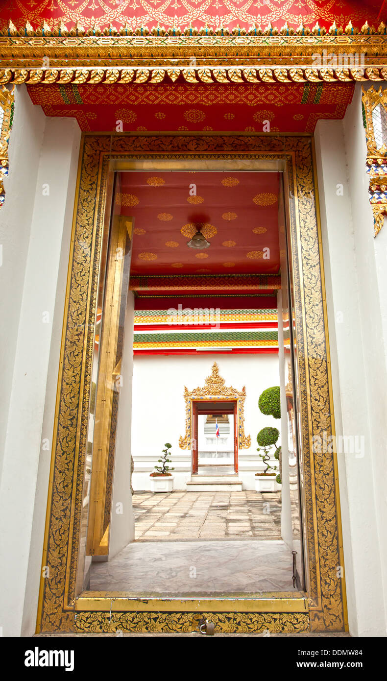 Temple door, carving golden wood decorated in Thai style door frame ...
