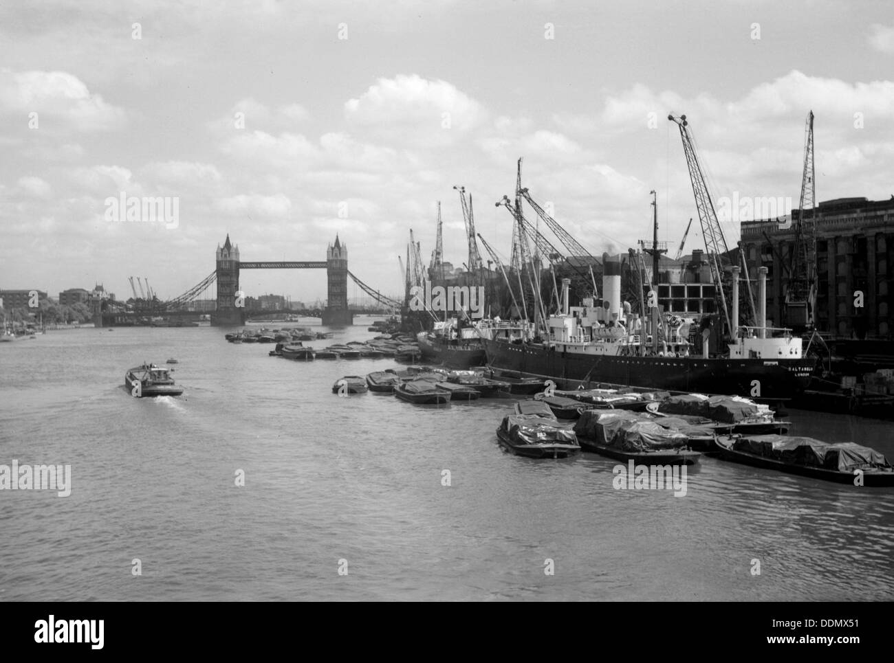 Tower Bridge with shipping in the Pool of London and at Hay's Wharf ...