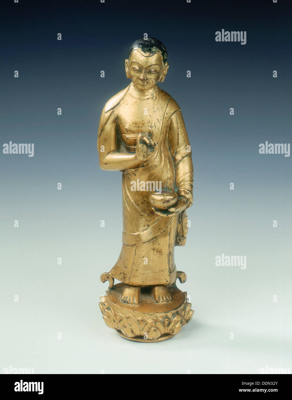 Gilt bronze statue of a standing monk with begging bowl, Yuan dynasty ...